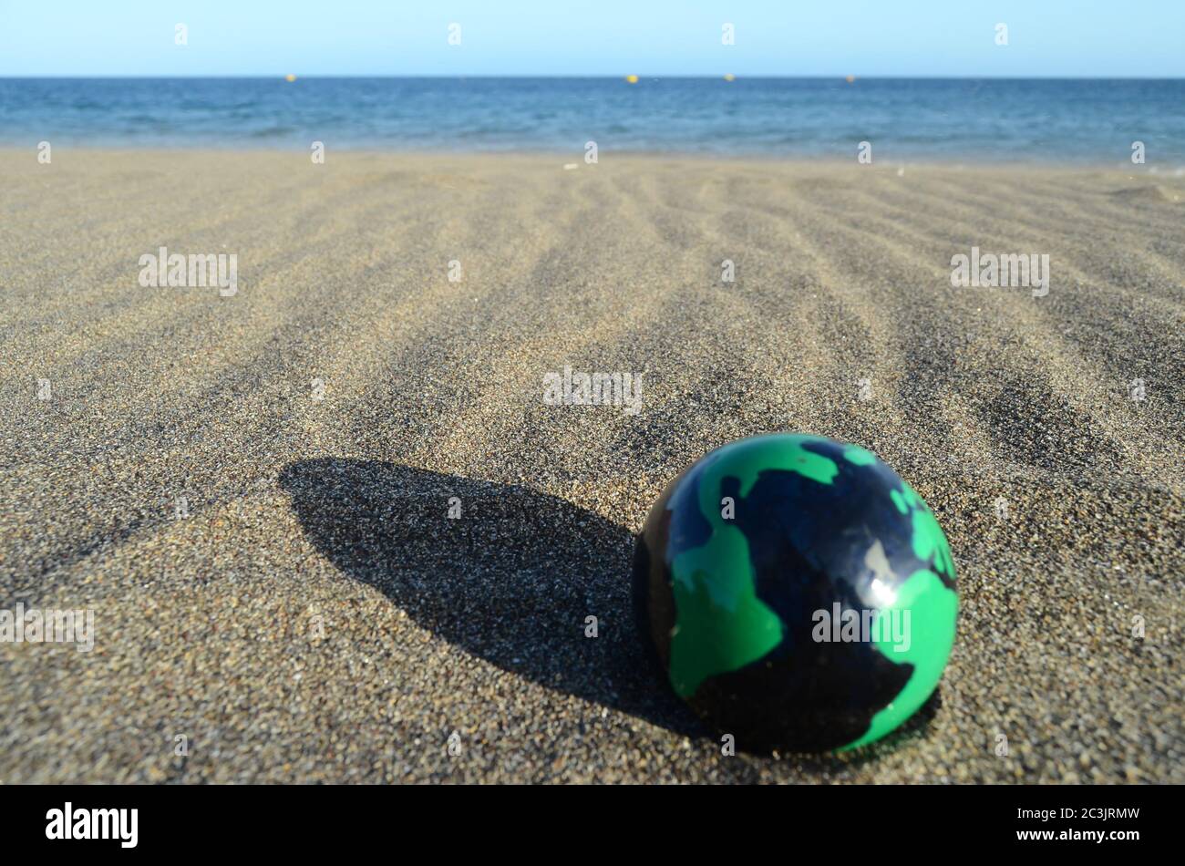 Globe Earth on the Beach near Ocean Stock Photo - Alamy
