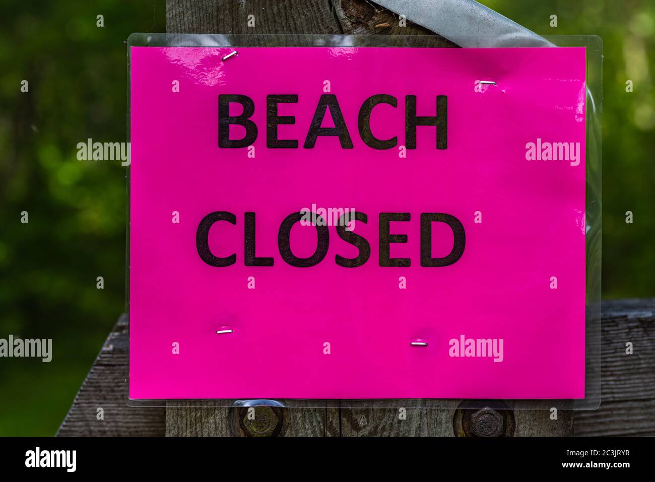 Signs for beach closure due to the Covid-19 pandemic Stock Photo - Alamy