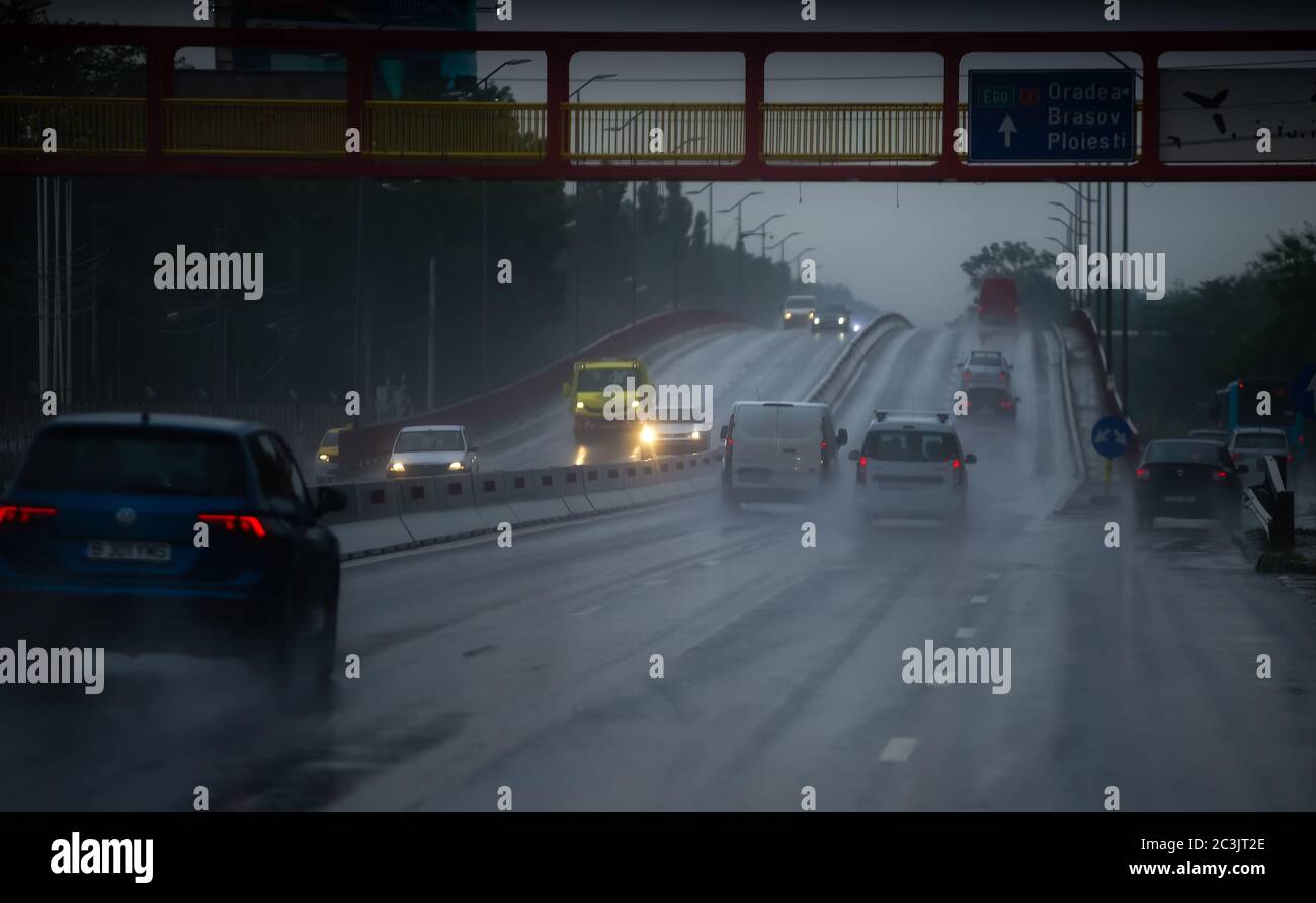 Otopeni, Romania - June 17, 2020: Cars run in the rain on a low ...