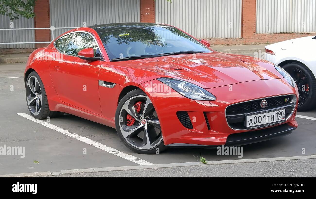Moscow. Autumn 2018. Red Jaguar F - type S parked near Porsche ...