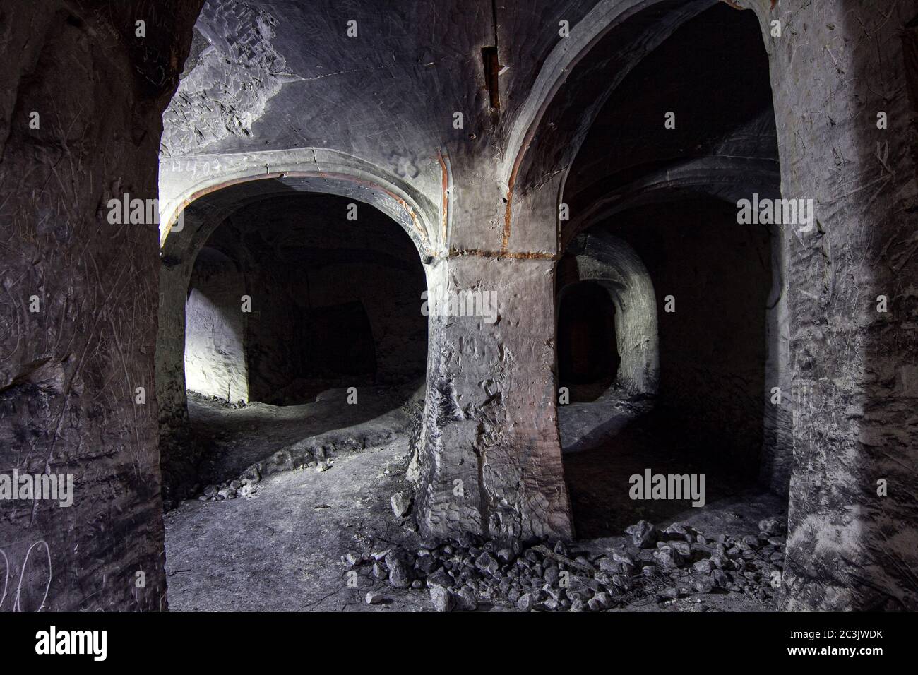 Dark creepy abandoned underground chalky cave temple Stock Photo - Alamy