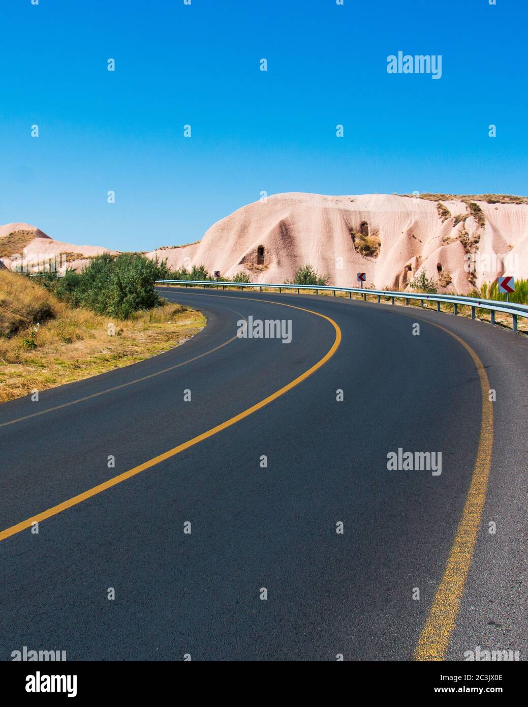 Yellow lane road in the desert Stock Photo - Alamy