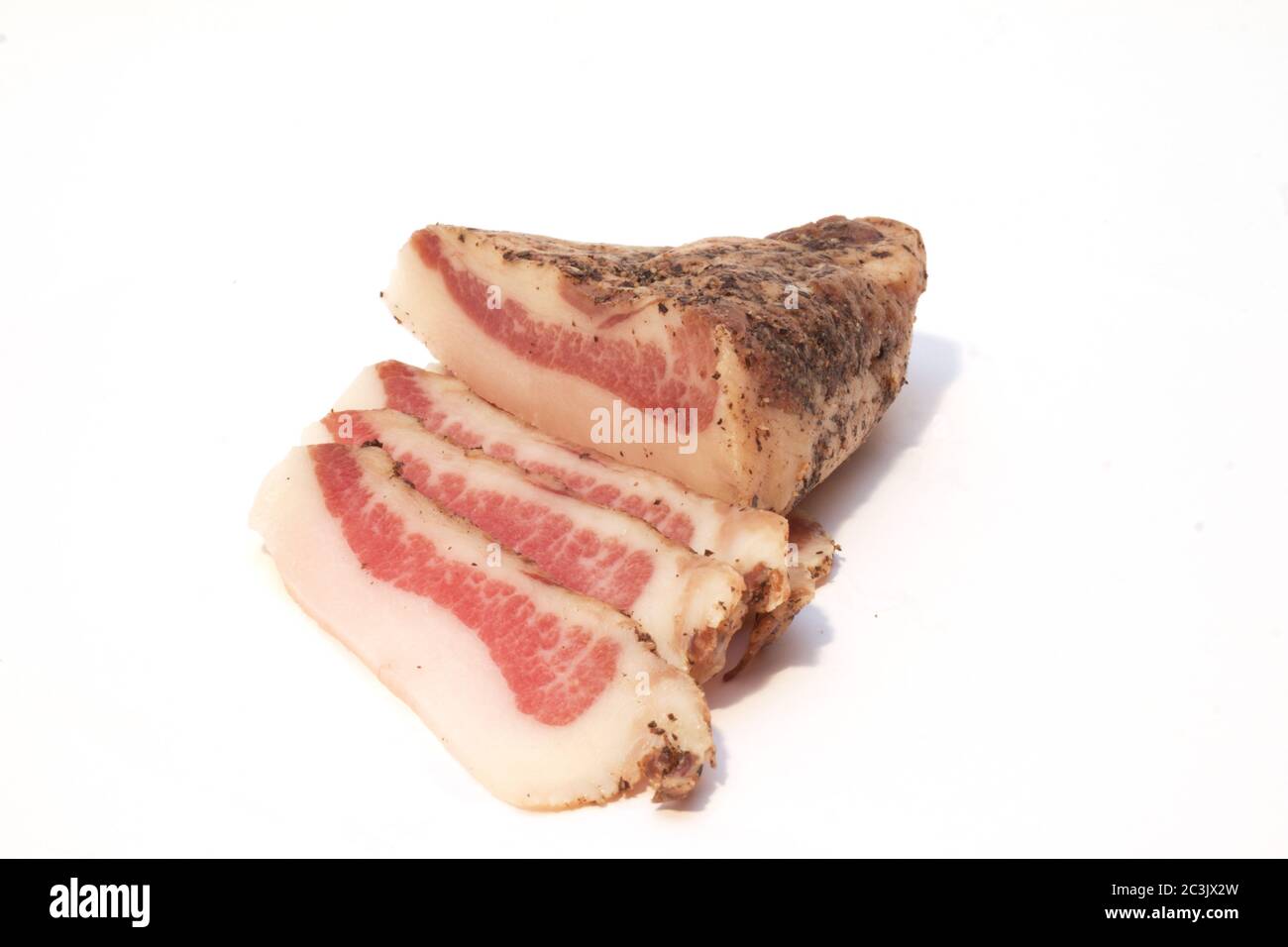 Closeup shot of pork cheek slices isolated on white background Stock ...
