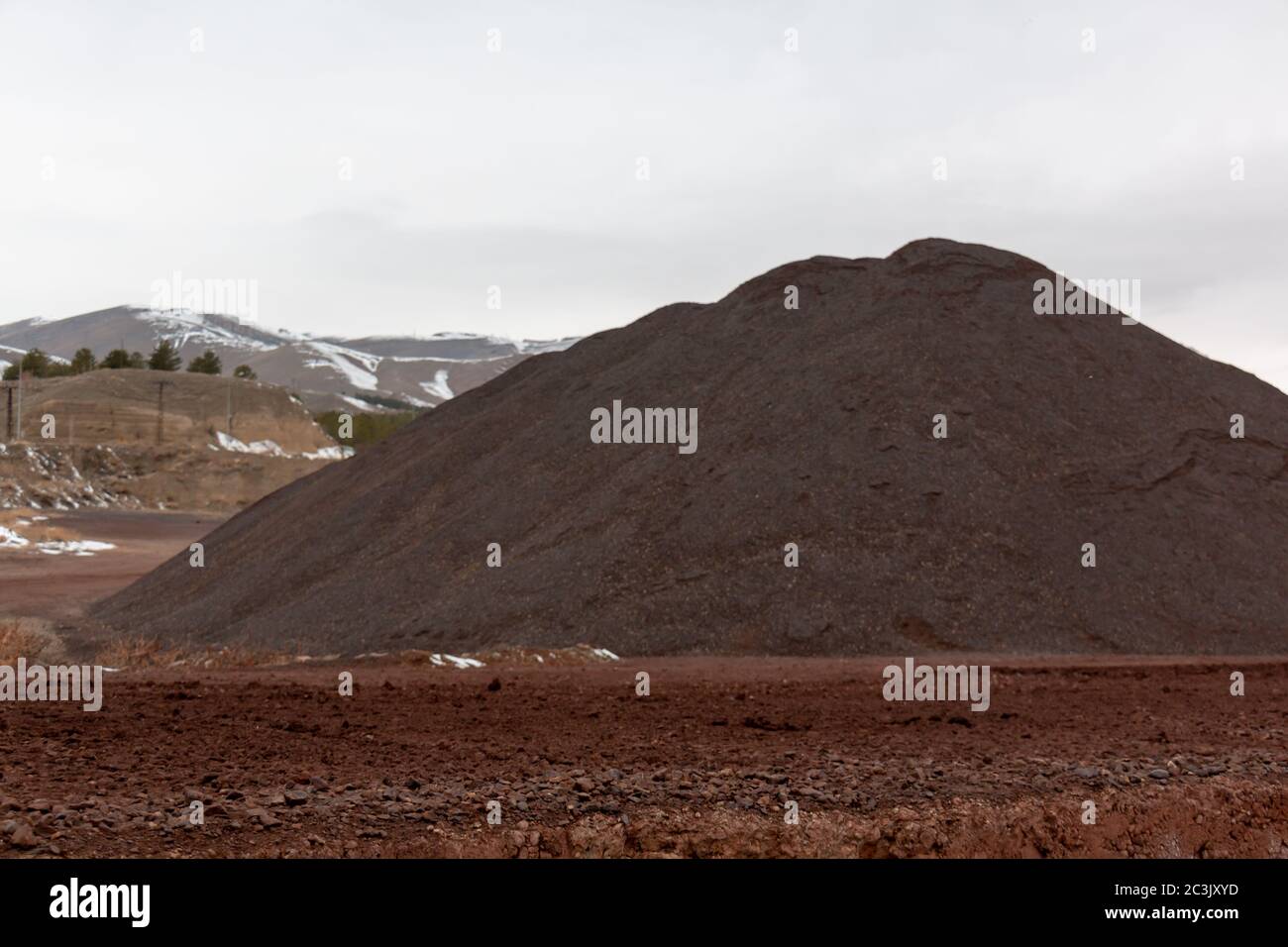 Pile of soil placed on flat ground Stock Photo - Alamy