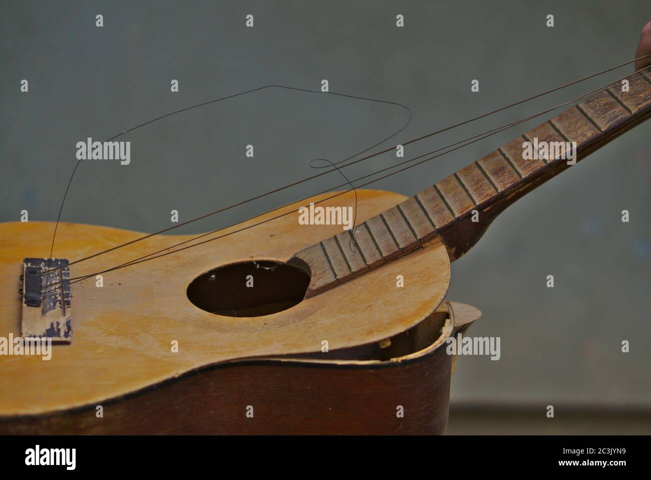 Closeup of a broken acoustic guitar Stock Photo - Alamy
