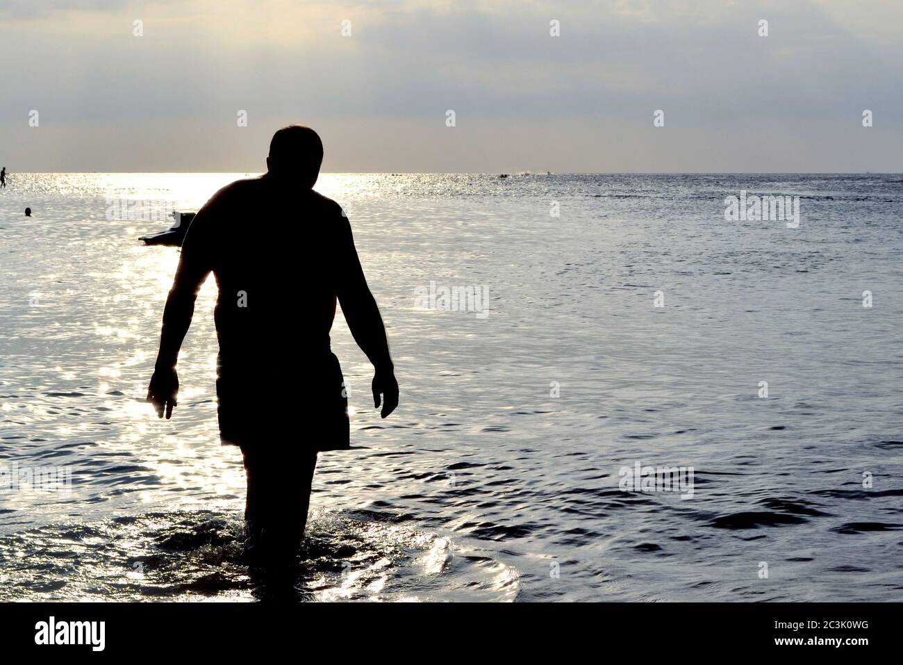 Man walking into the sea at Kata Beach, Phuket, Thailand Stock Photo ...