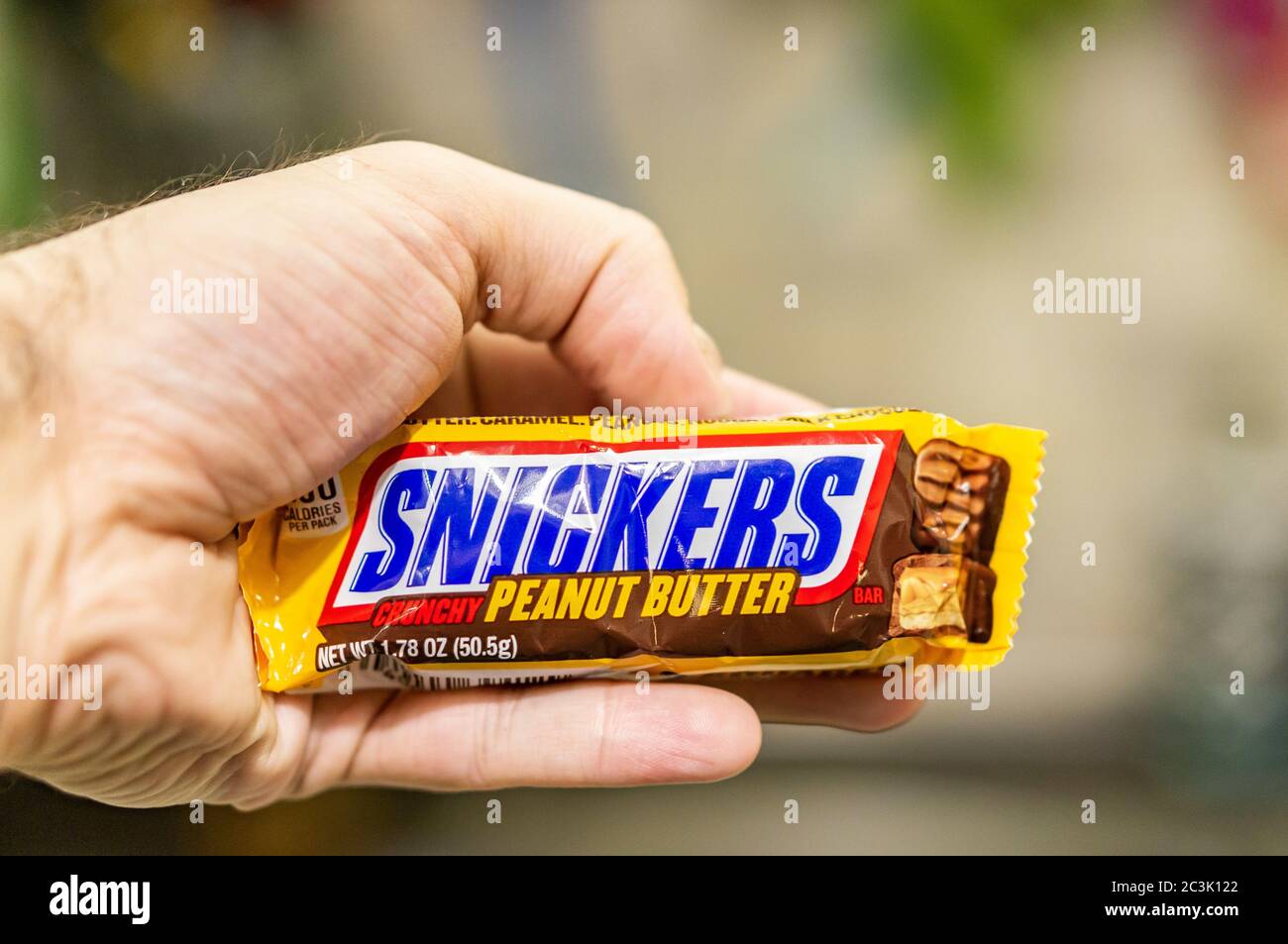 Hand holding snickers hi-res stock photography and images - Alamy