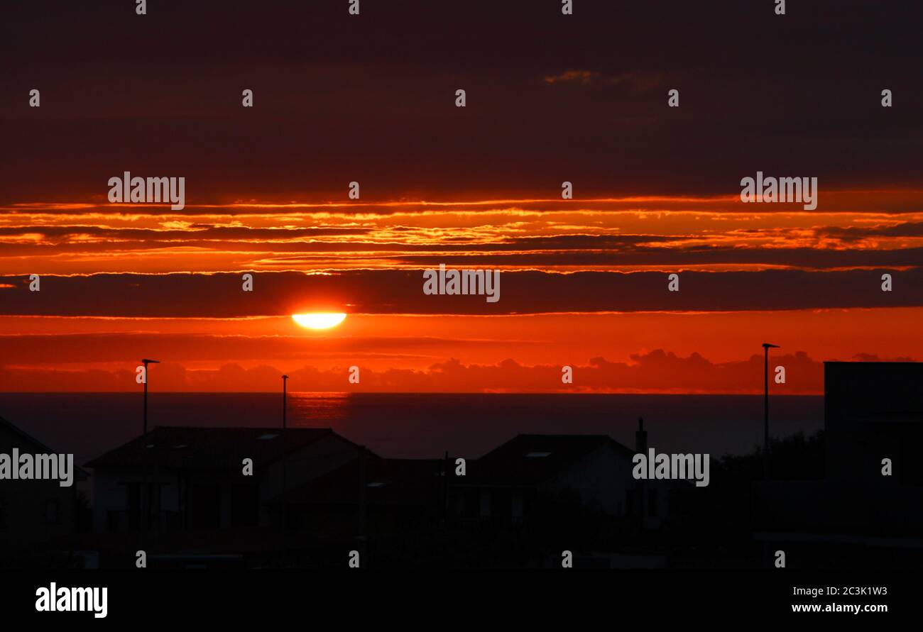 Sunset with extreme colours and urban silhouette Stock Photo - Alamy