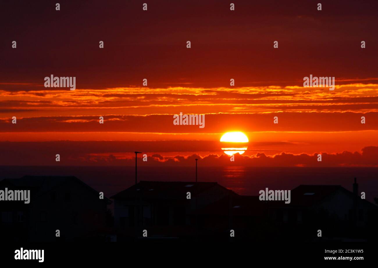 Sunset with extreme colours and urban silhouette Stock Photo - Alamy
