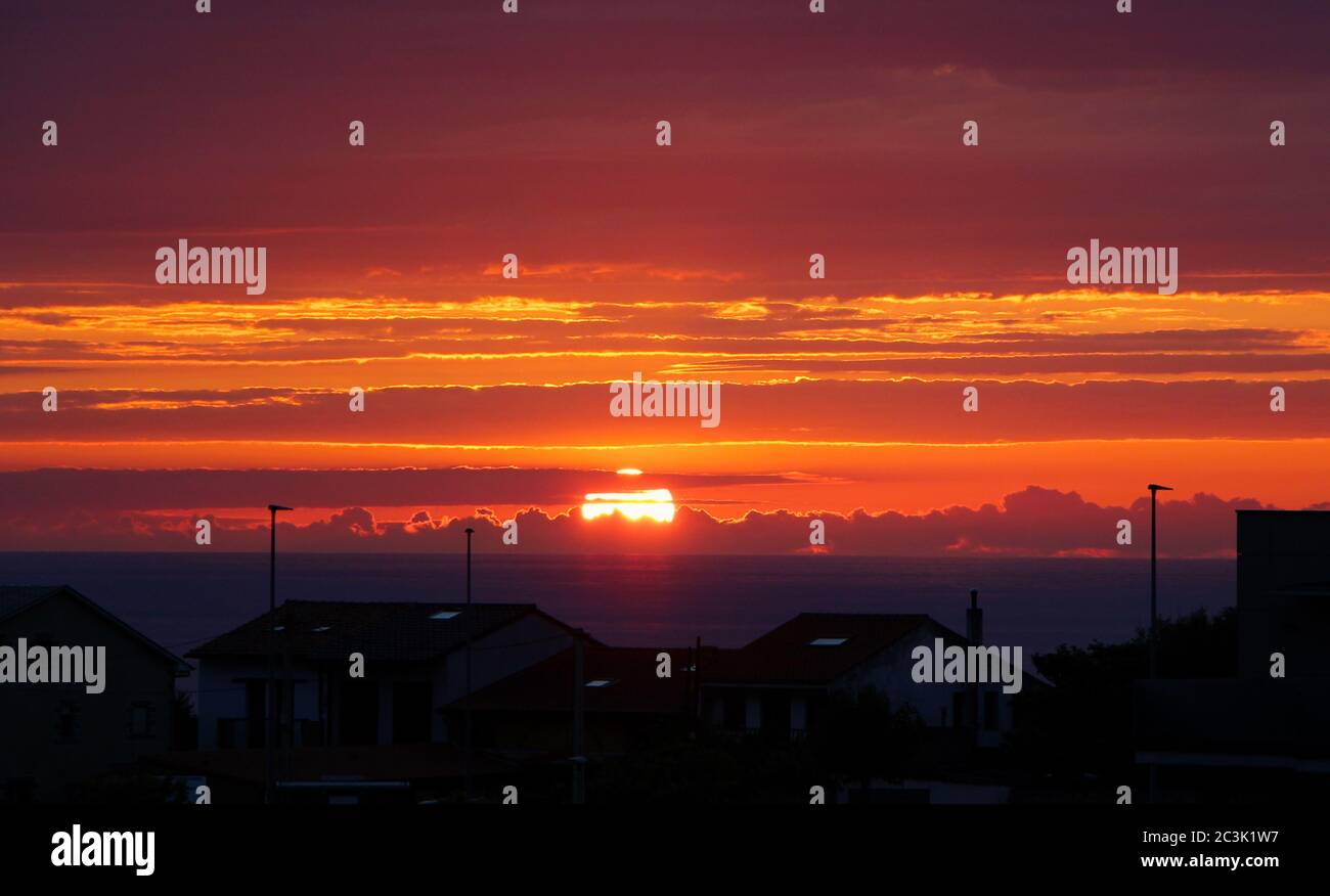 Sunset with extreme colours and urban silhouette Stock Photo - Alamy