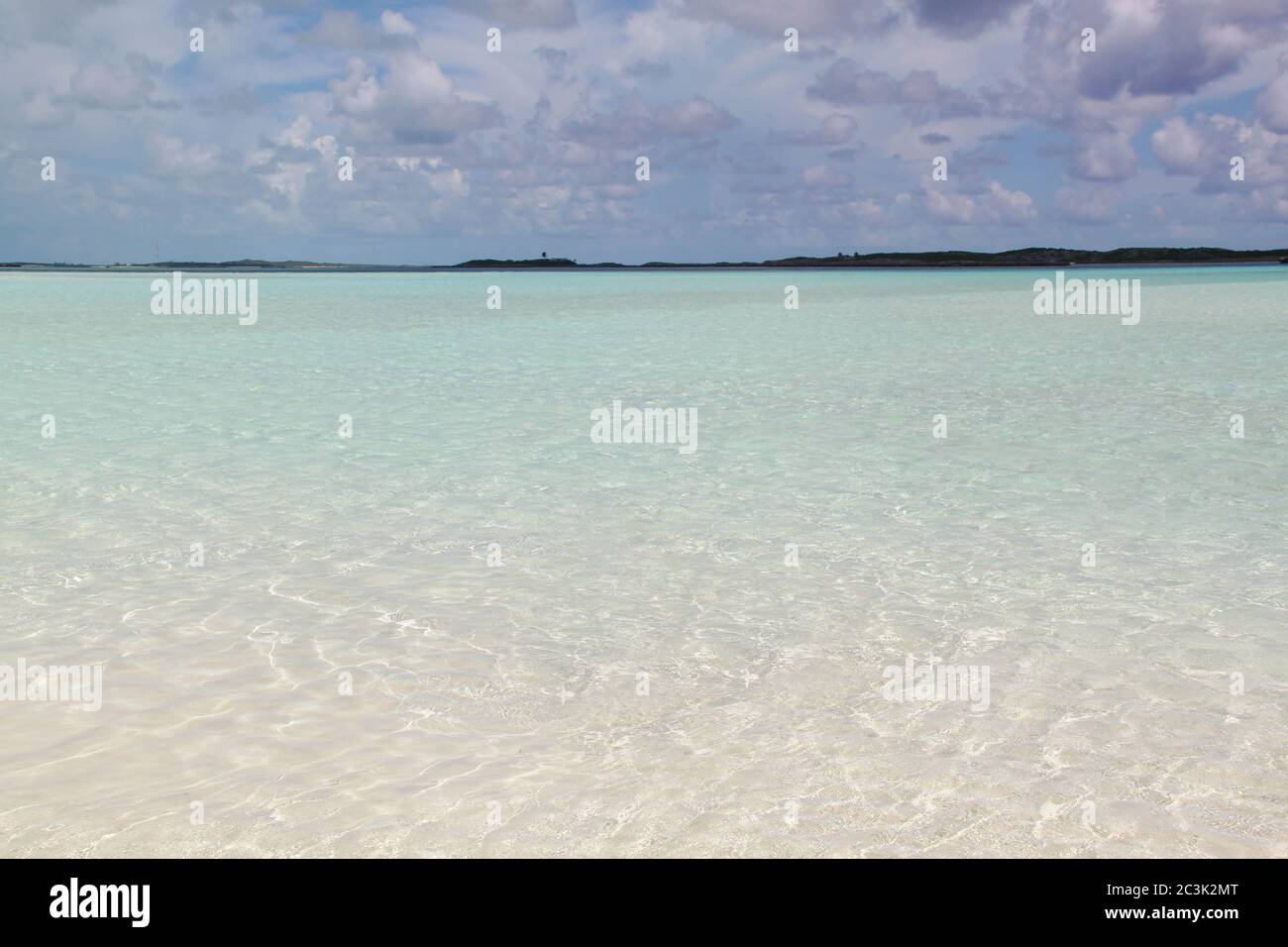 Beautiful blue ocean and white sand beach on clean blue sky background ...