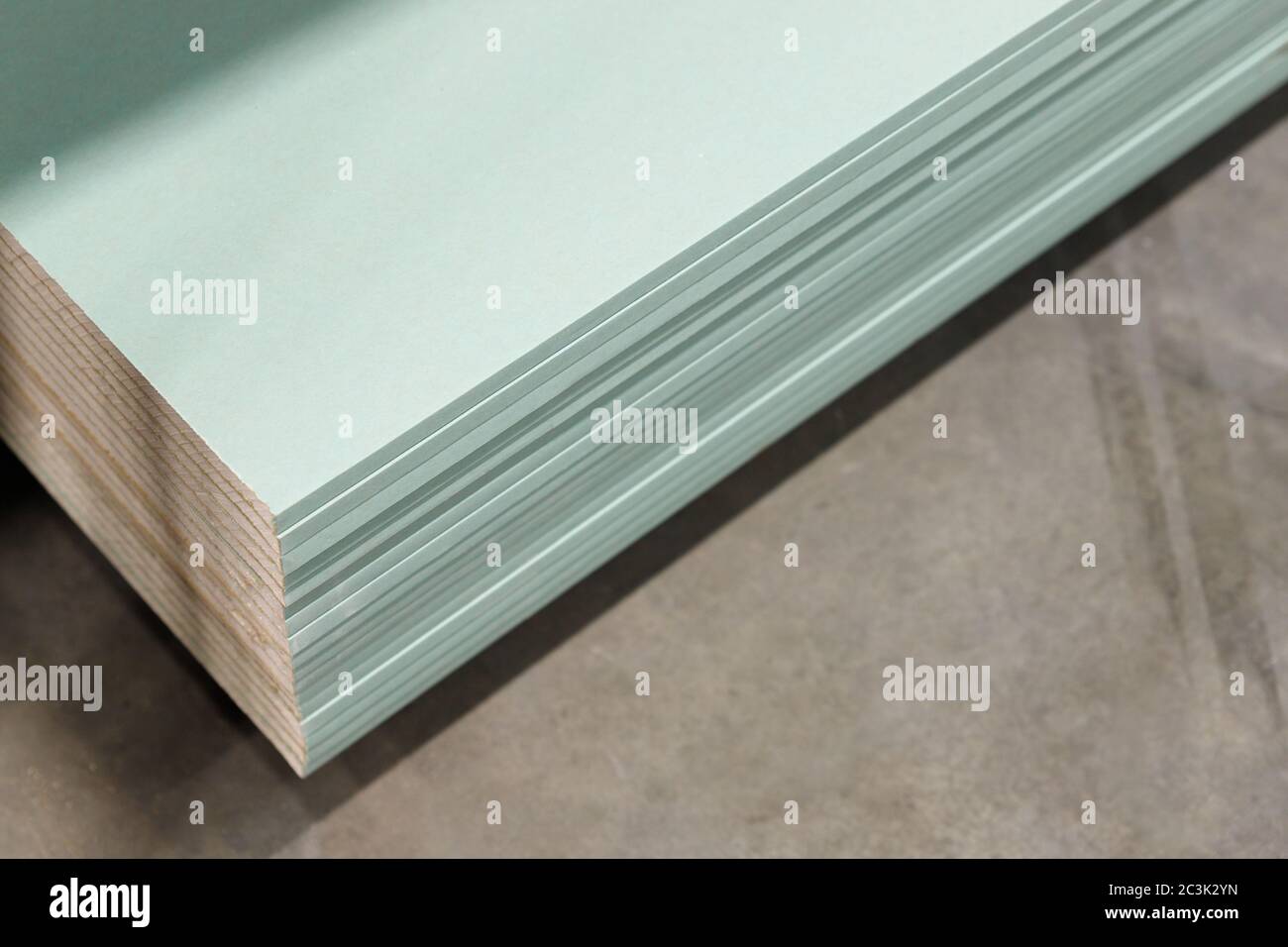 High angle closeup of green plasterboard on a grey surface Stock Photo ...