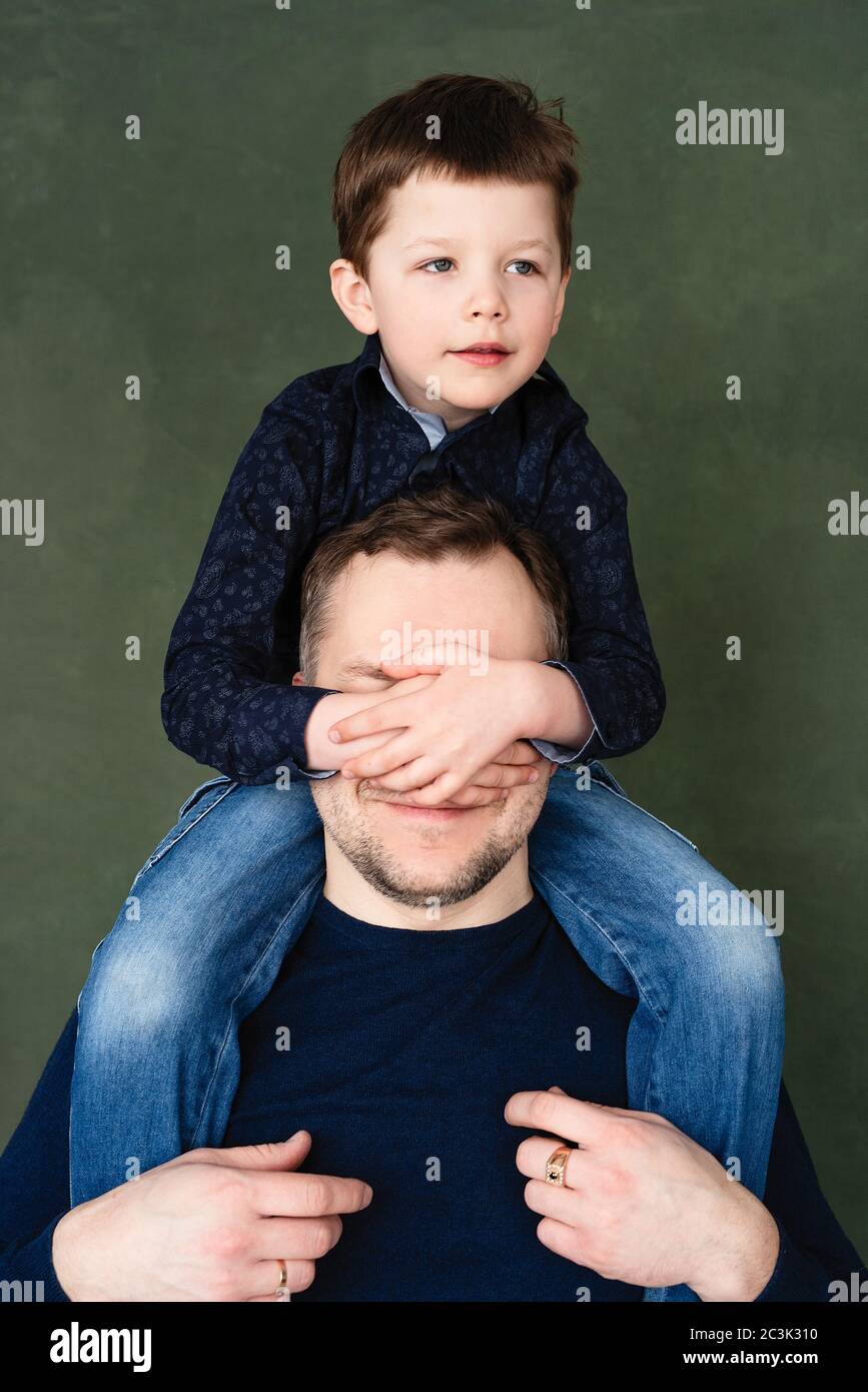 Child on dads shoulders hi-res stock photography and images - Alamy