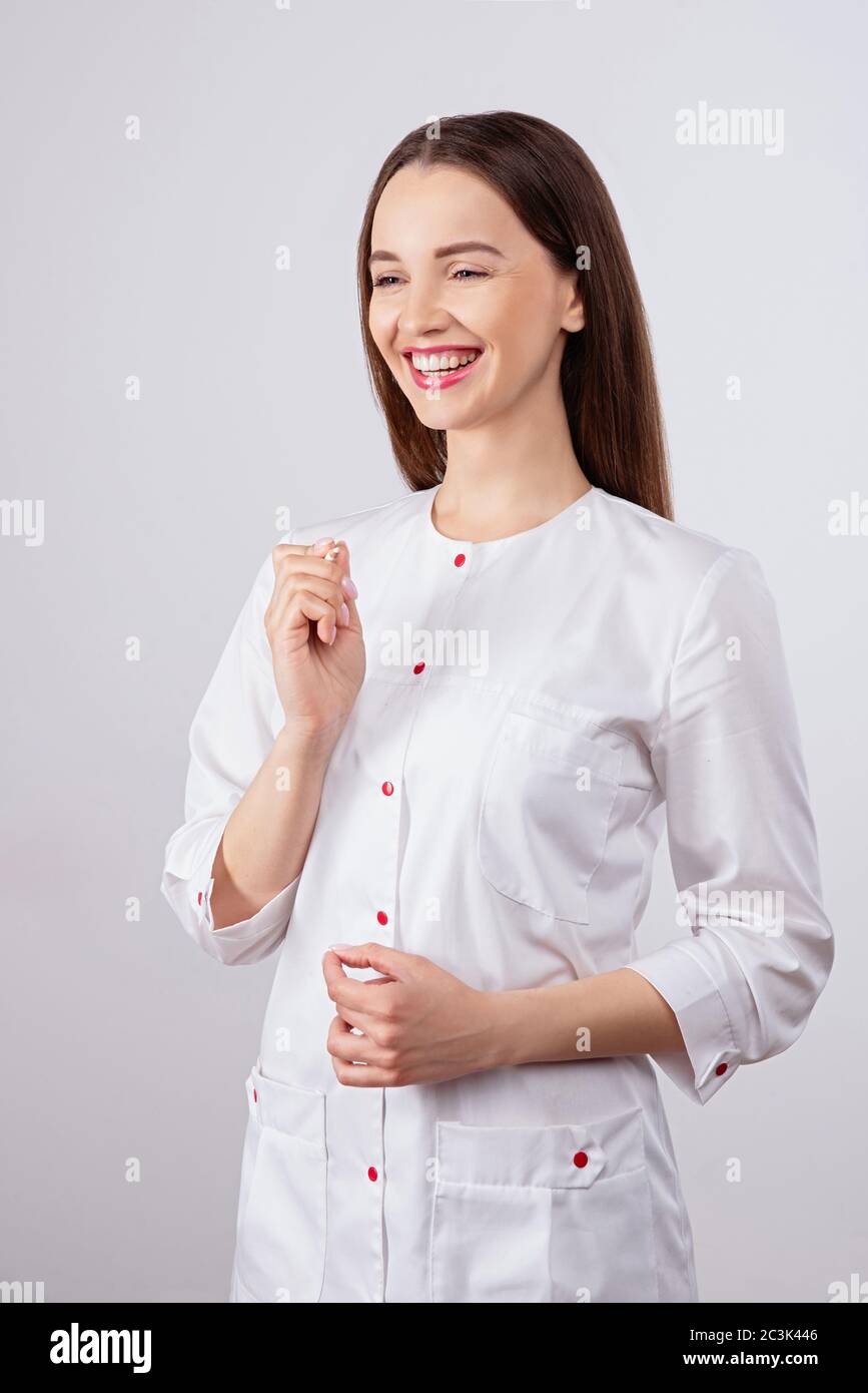 medic with smile on his face holds pencil in his hand, joyful emotions ...