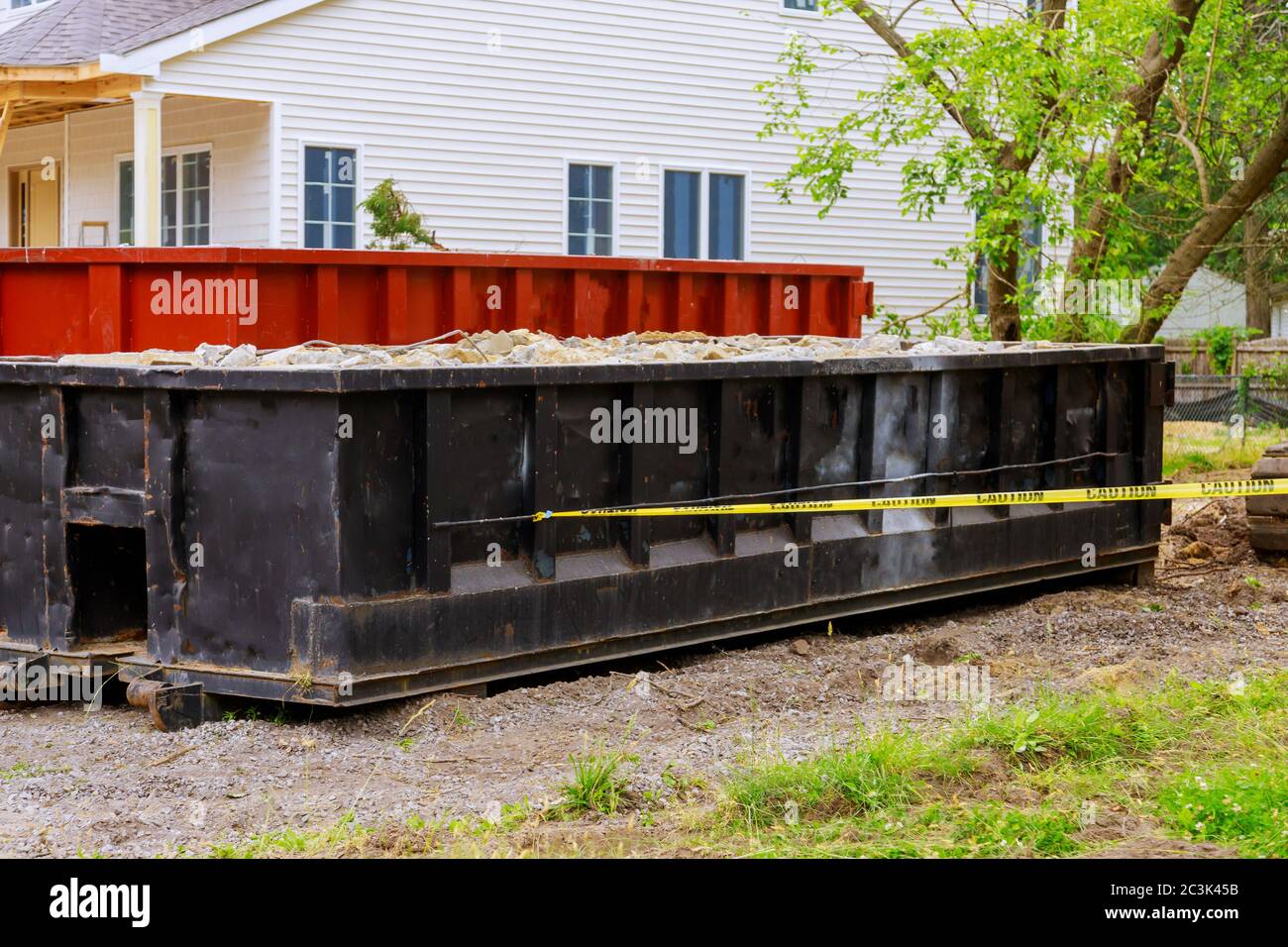 Rubbish removal container loaded dumpster a construction home ...