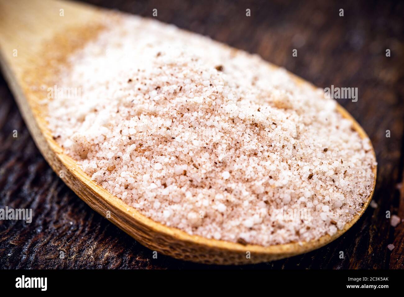 wooden spoon with refined sugar and powdered cinnamon. Typical ...