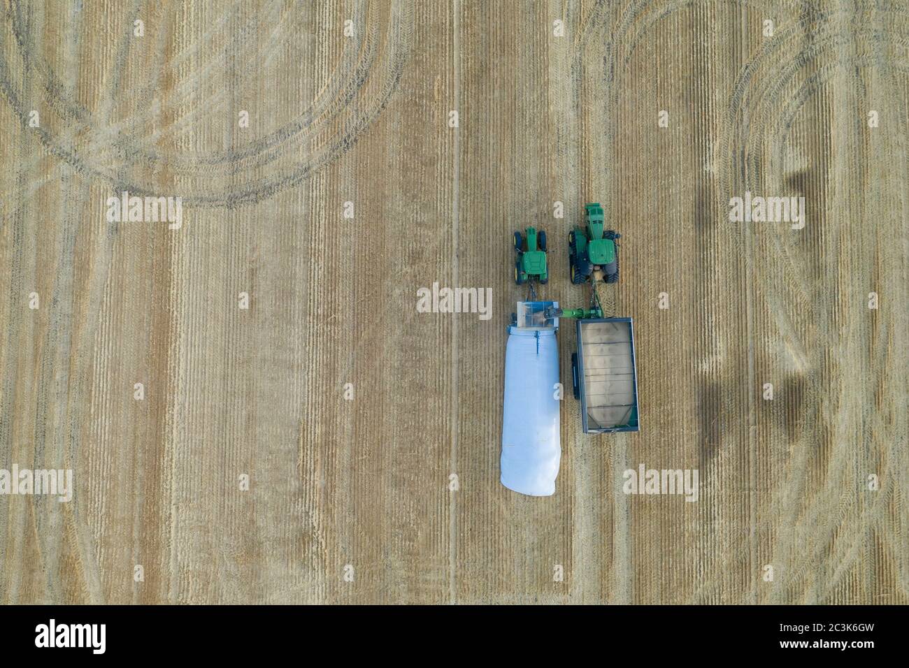 Overhead view of a farming field with tractors during daytime Stock ...