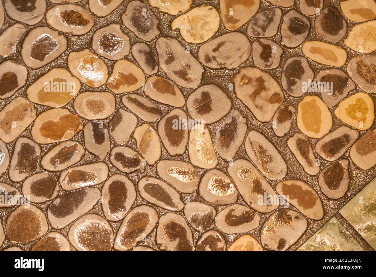 Decorative inlaid polished pebbles on an elevator floor, in a ...