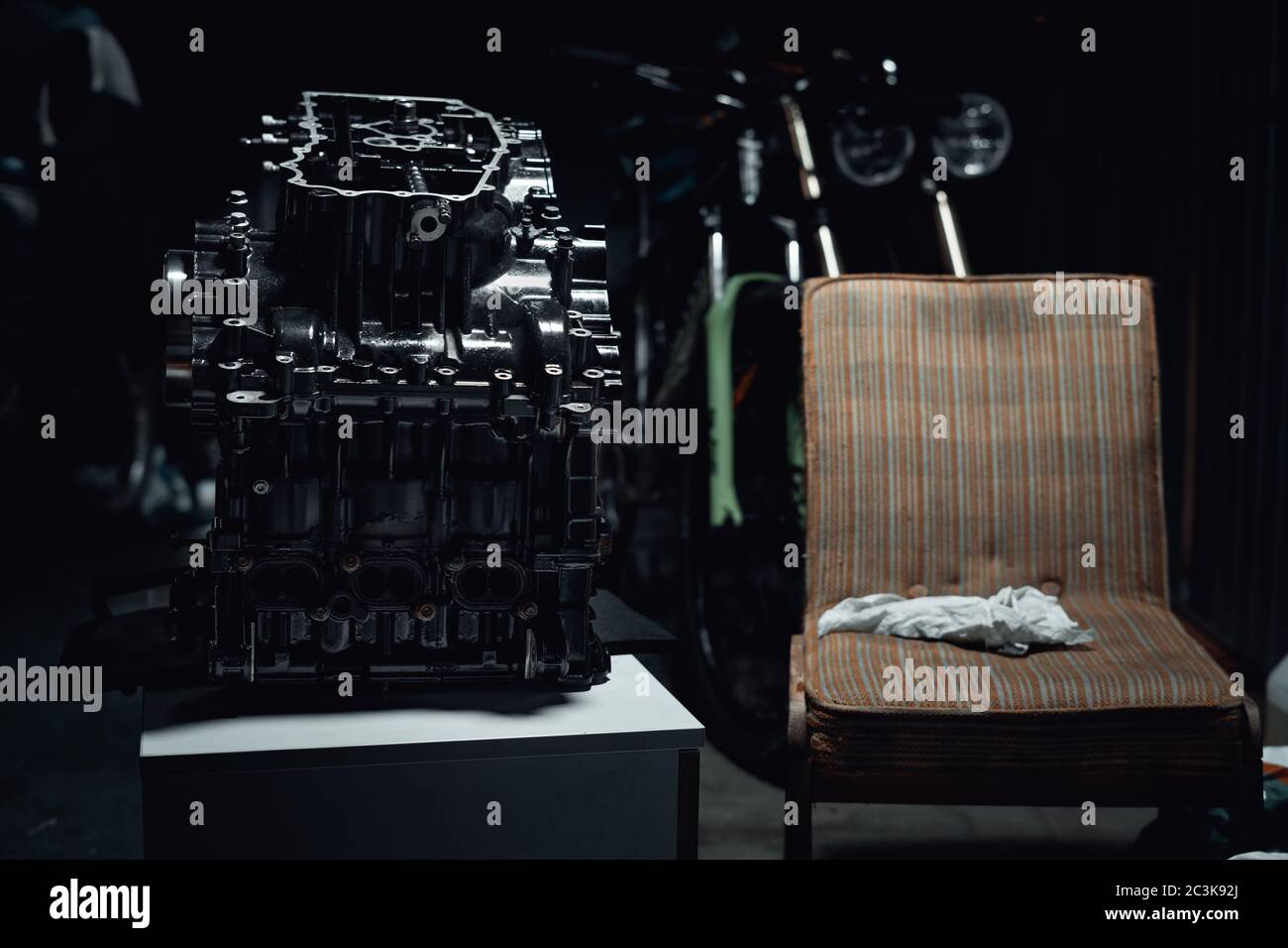 Assembled fast motorcycle engine stands on the table ready to mount on ...