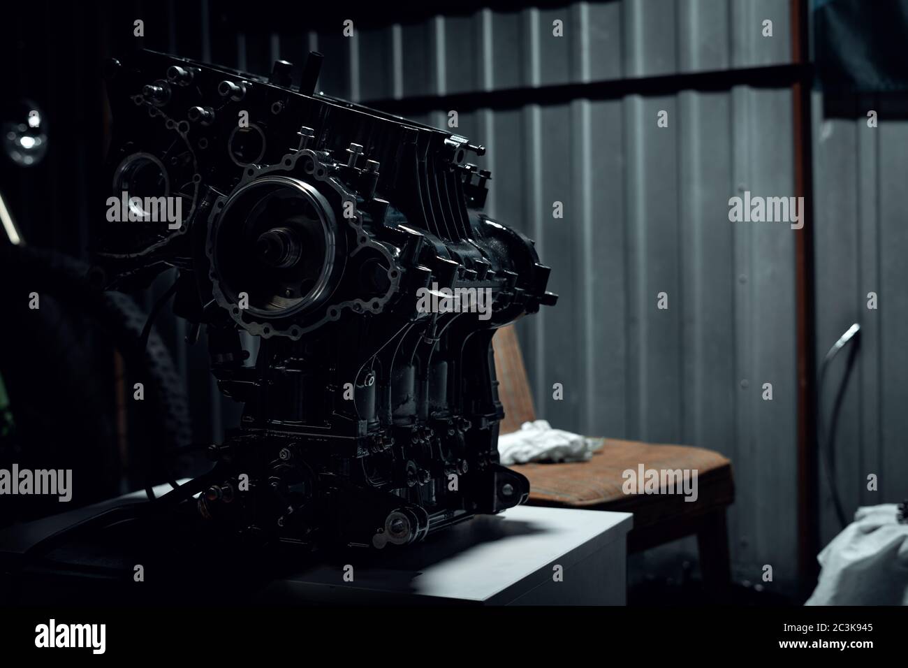 Assembled fast motorcycle engine stands on the table ready to mount on ...