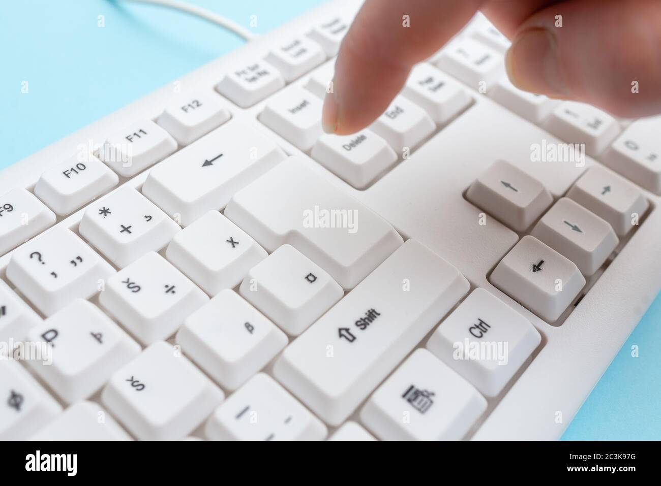 Pc keyboard key with pointing finger above background copy space Stock ...