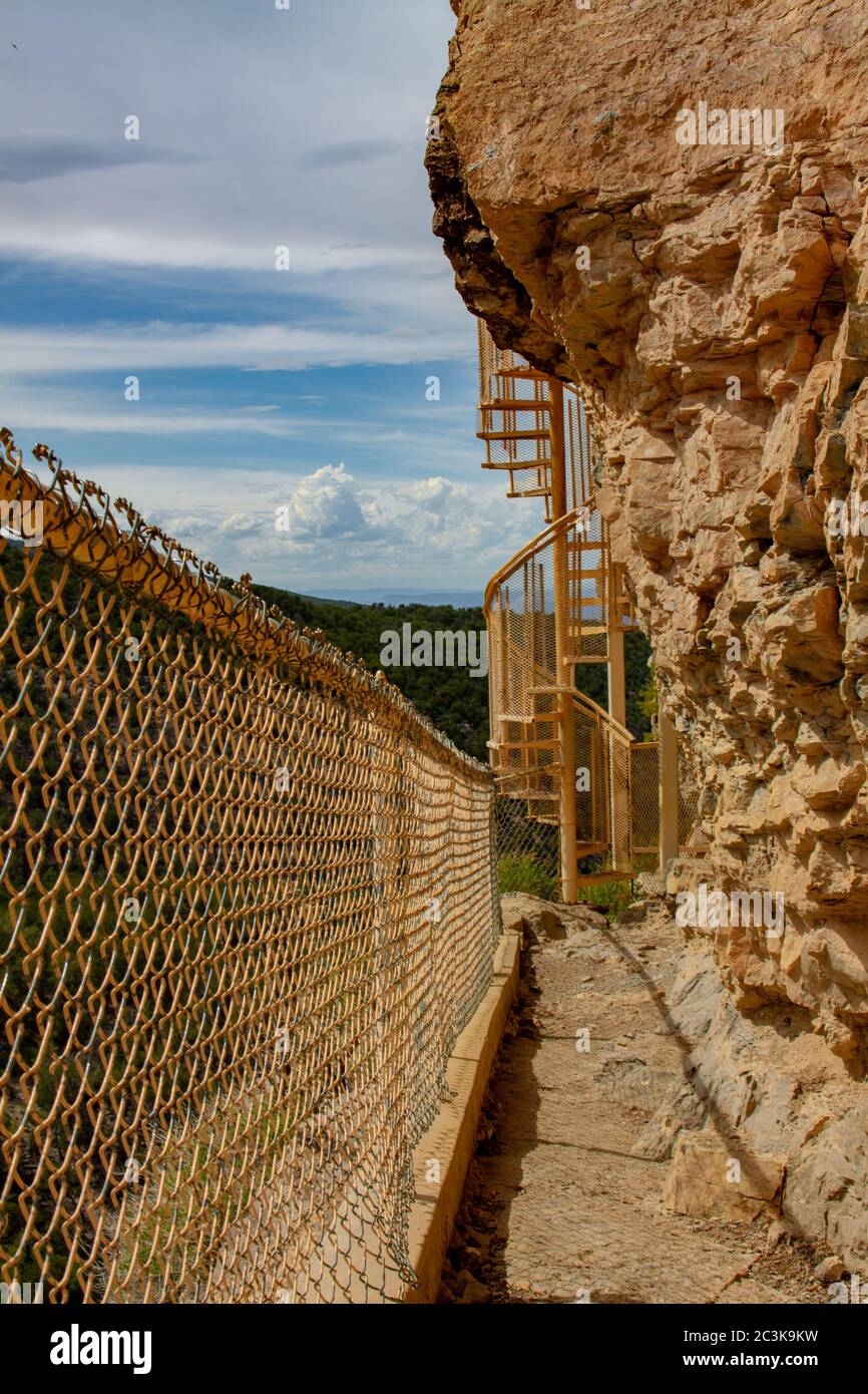 Spiral staircase and fence railing on the Sandia Man Cave Trail in the ...