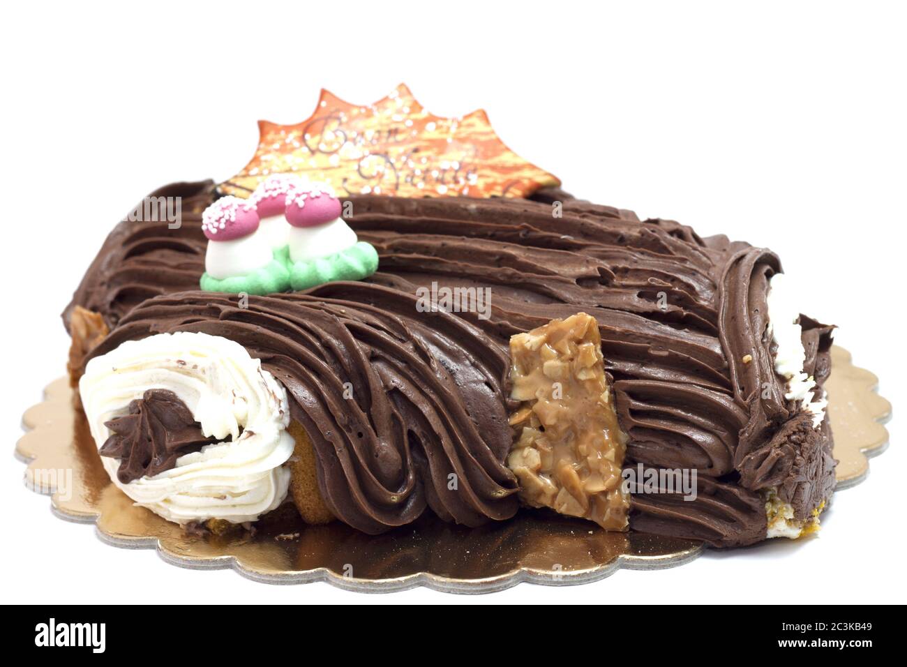 Delicious traditional sweet Christmas log isolated on a white ...
