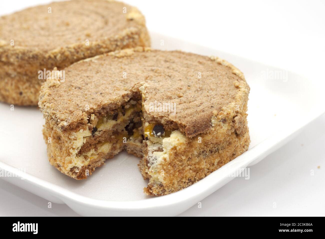 Delicious small round cakes isolated on a white background Stock Photo ...