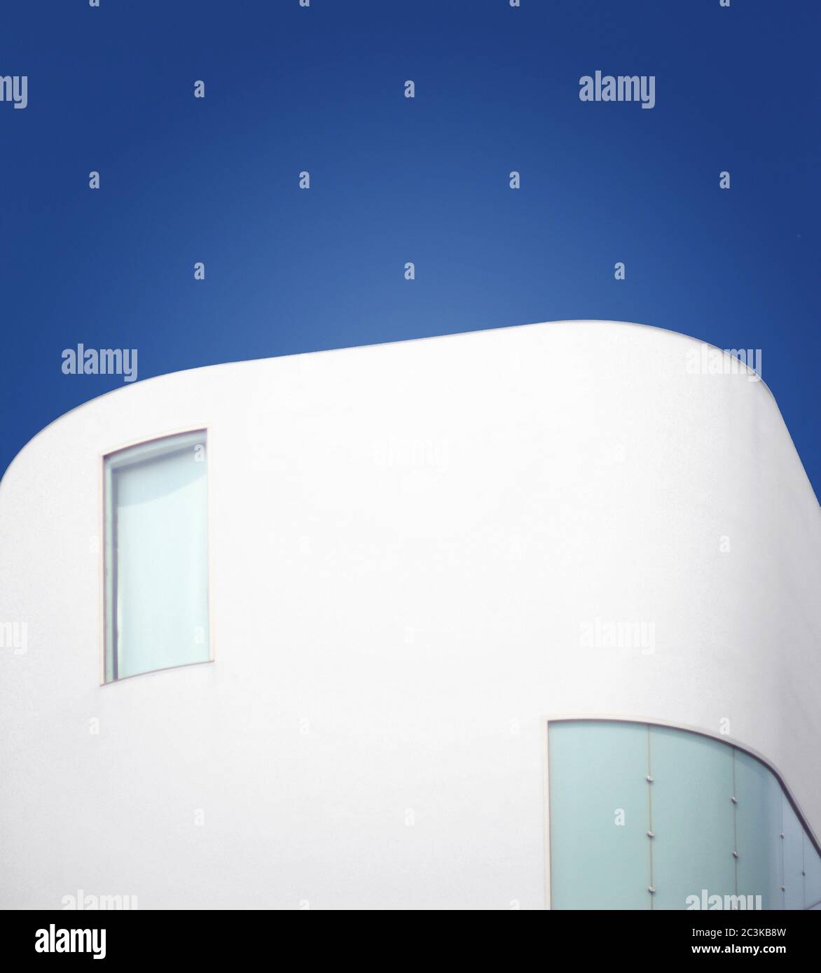 Facade of a modern building with curved corners Stock Photo - Alamy