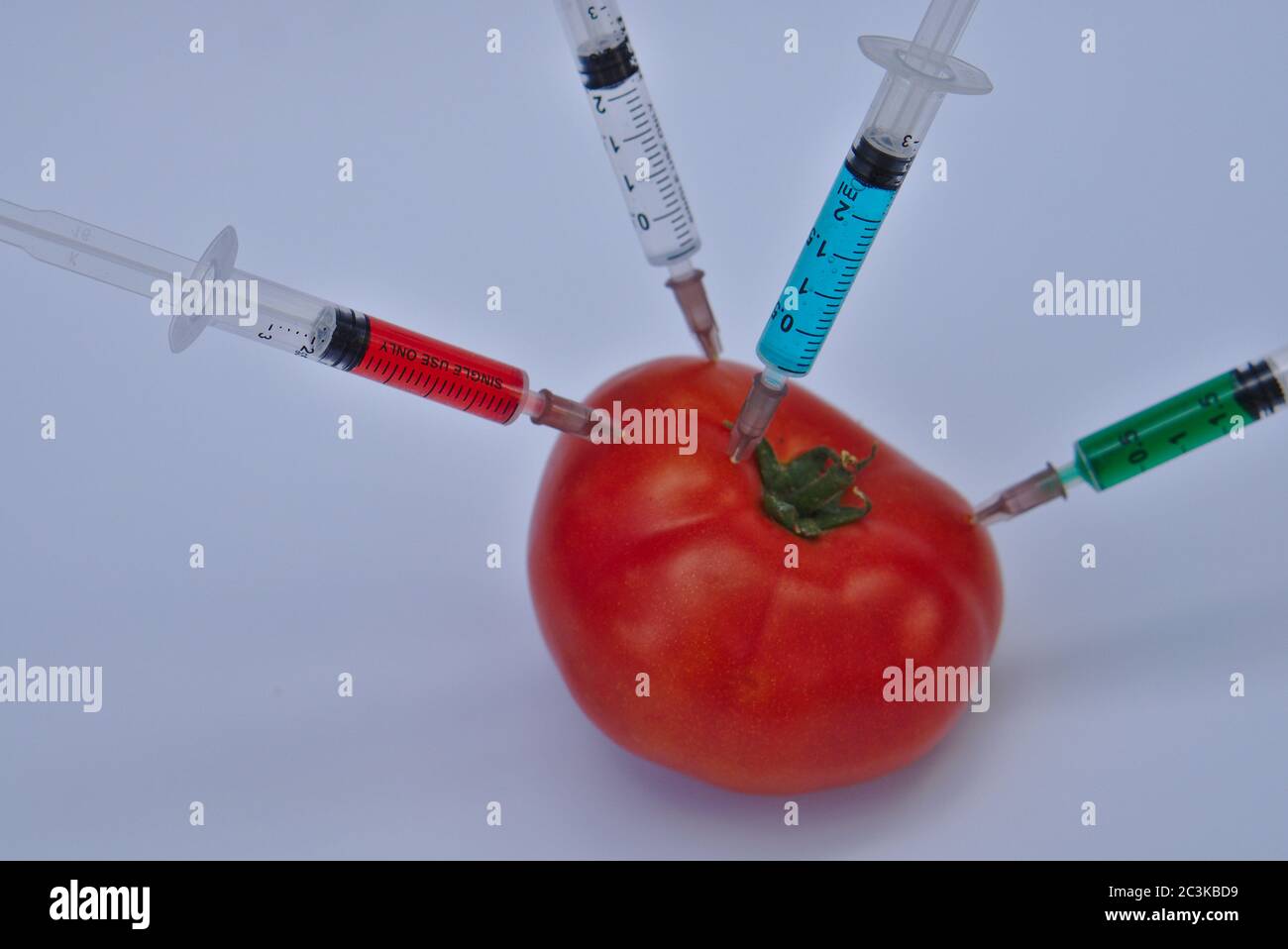 Process of injection of some substances into a fresh red tomato Stock ...