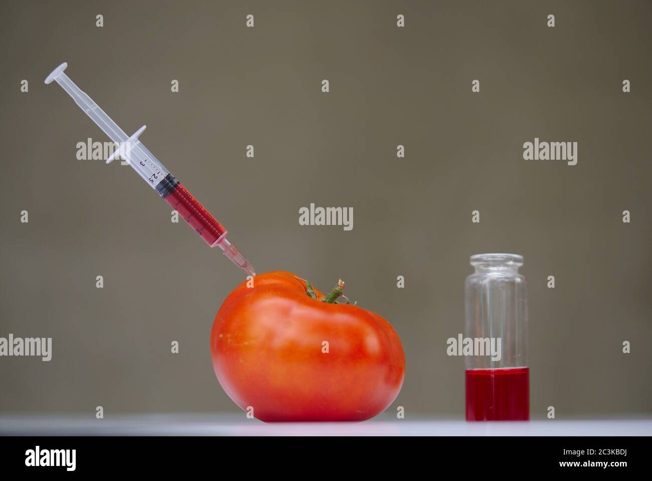 Process of injection of some substances into a fresh red tomato Stock ...