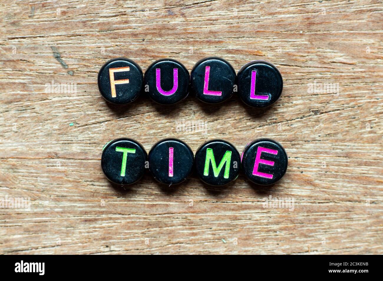 Black bead with color letter in word full time on wood background Stock ...