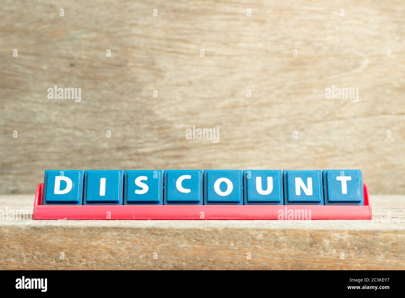 Tile letter on red rack in word discount on wood background Stock Photo ...