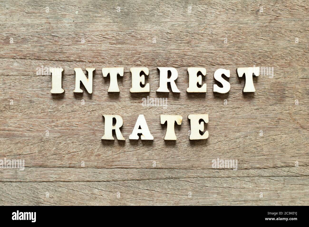 Alphabet letter block in word interest rate on wood background Stock ...