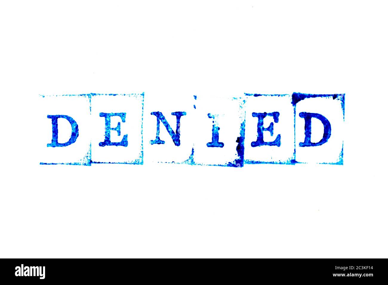 Blue ink of rubber stamp in word denied on white paper background Stock ...