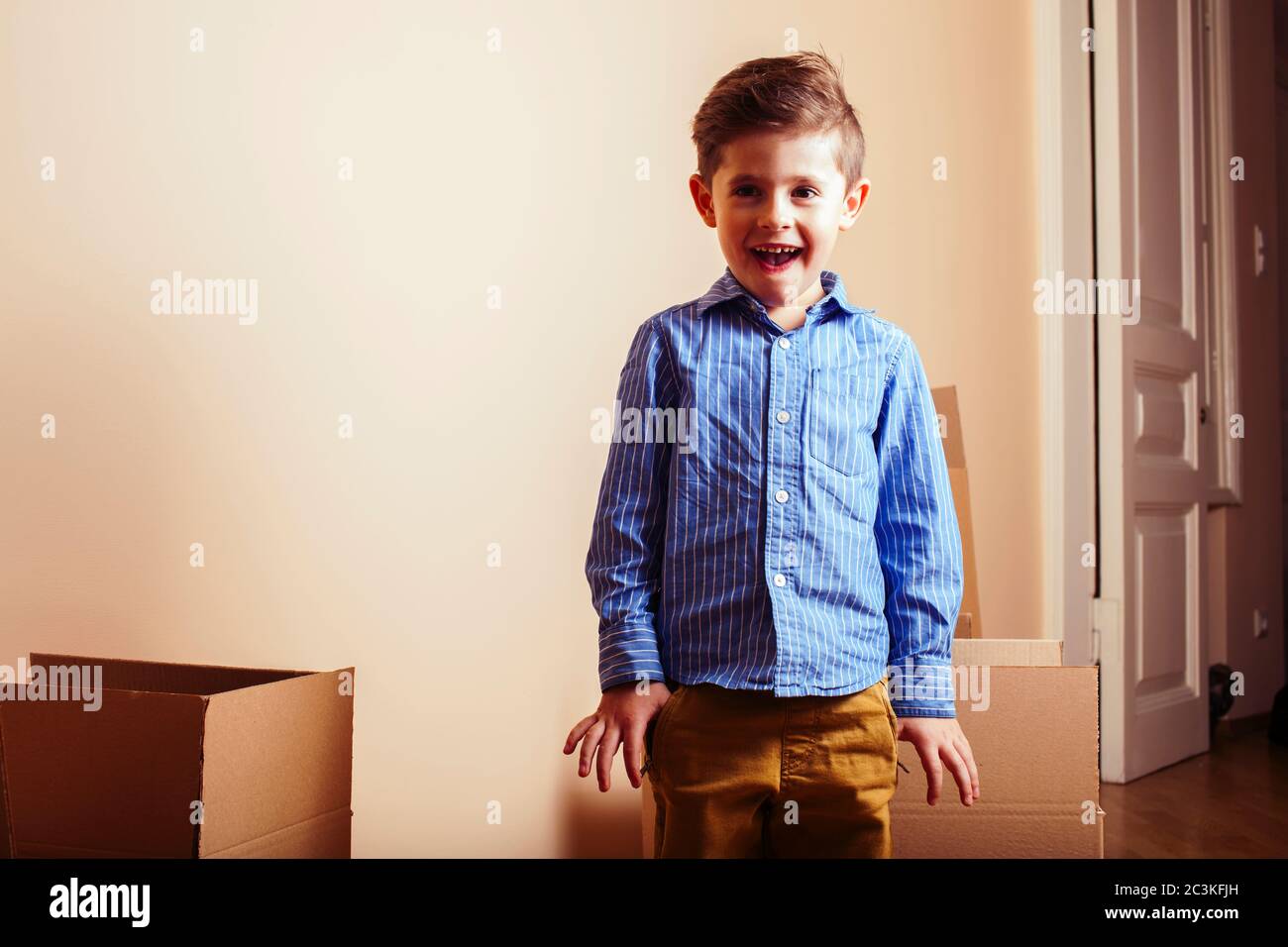 little cute boy in empty room, move to new house. home alone among ...