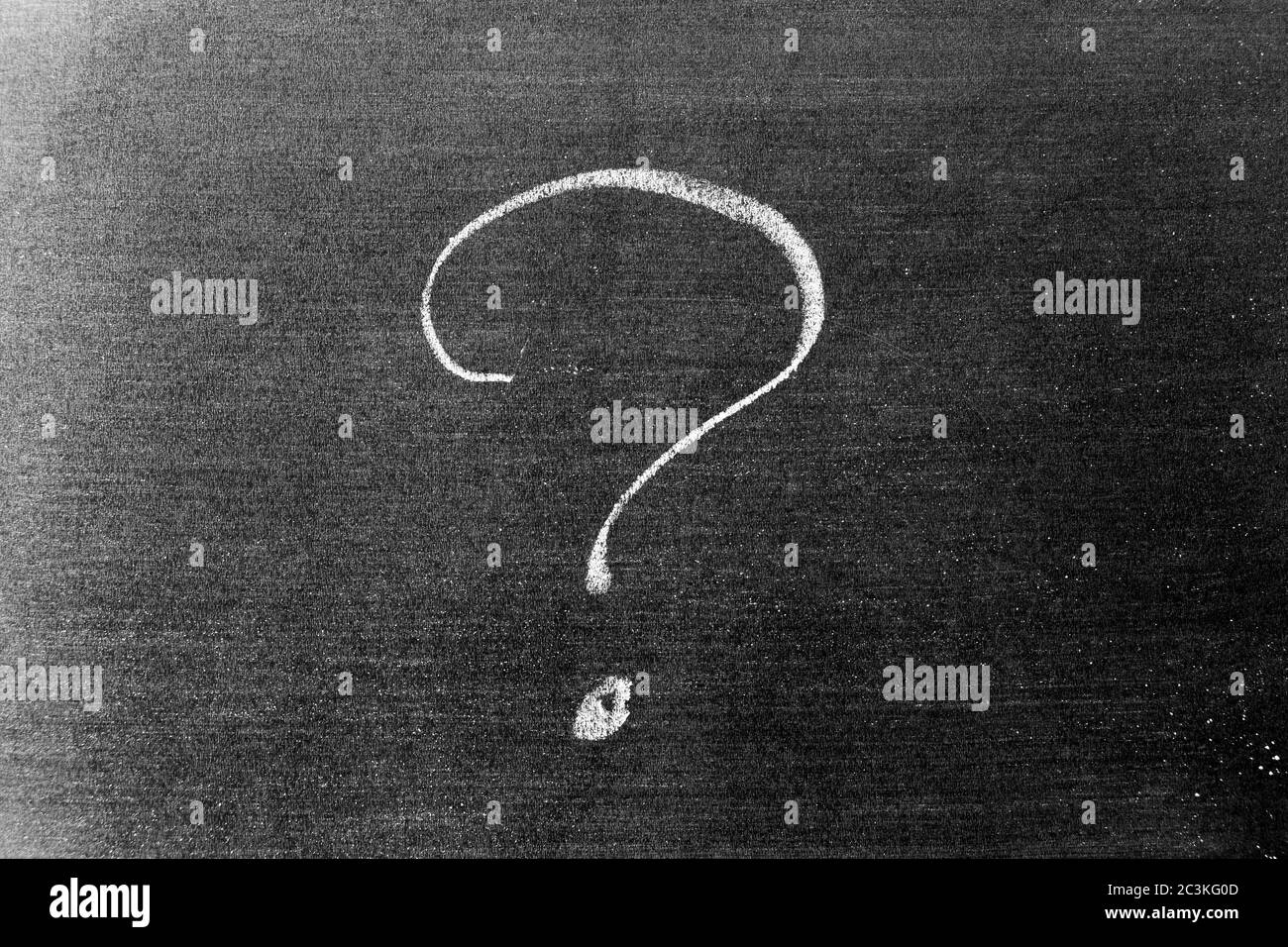 White color chalk hand drawing in question mark shape on blackboard ...