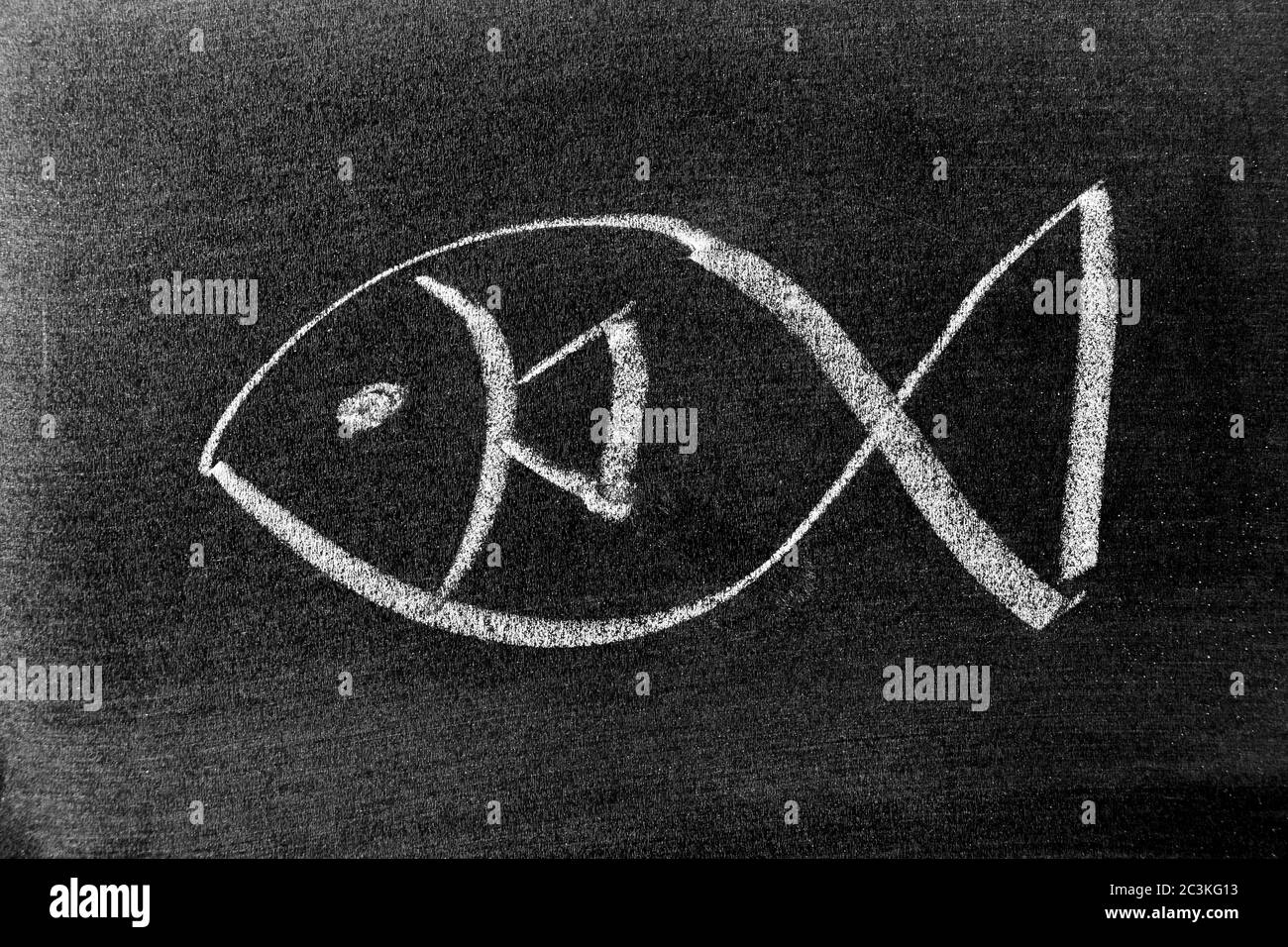White color chalk drawing in fish shape on blackboard background Stock ...