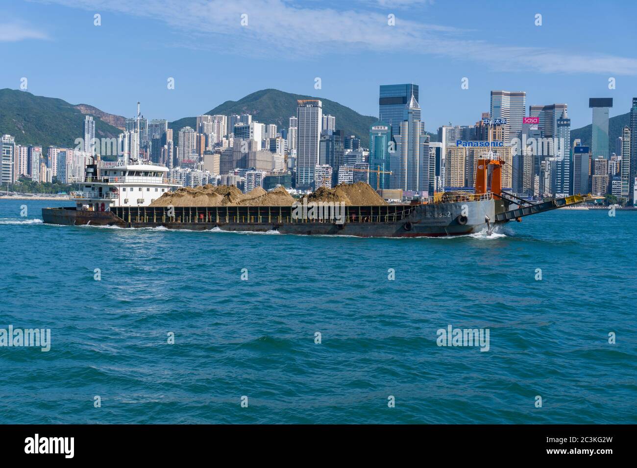 Sand Carrier, Sand Barge Cargo Ship sailing across the Victoria Harbor ...