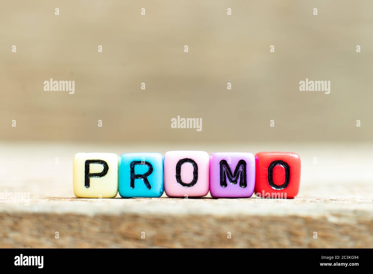 Colorful bead with black letter in word promo on wood background Stock ...