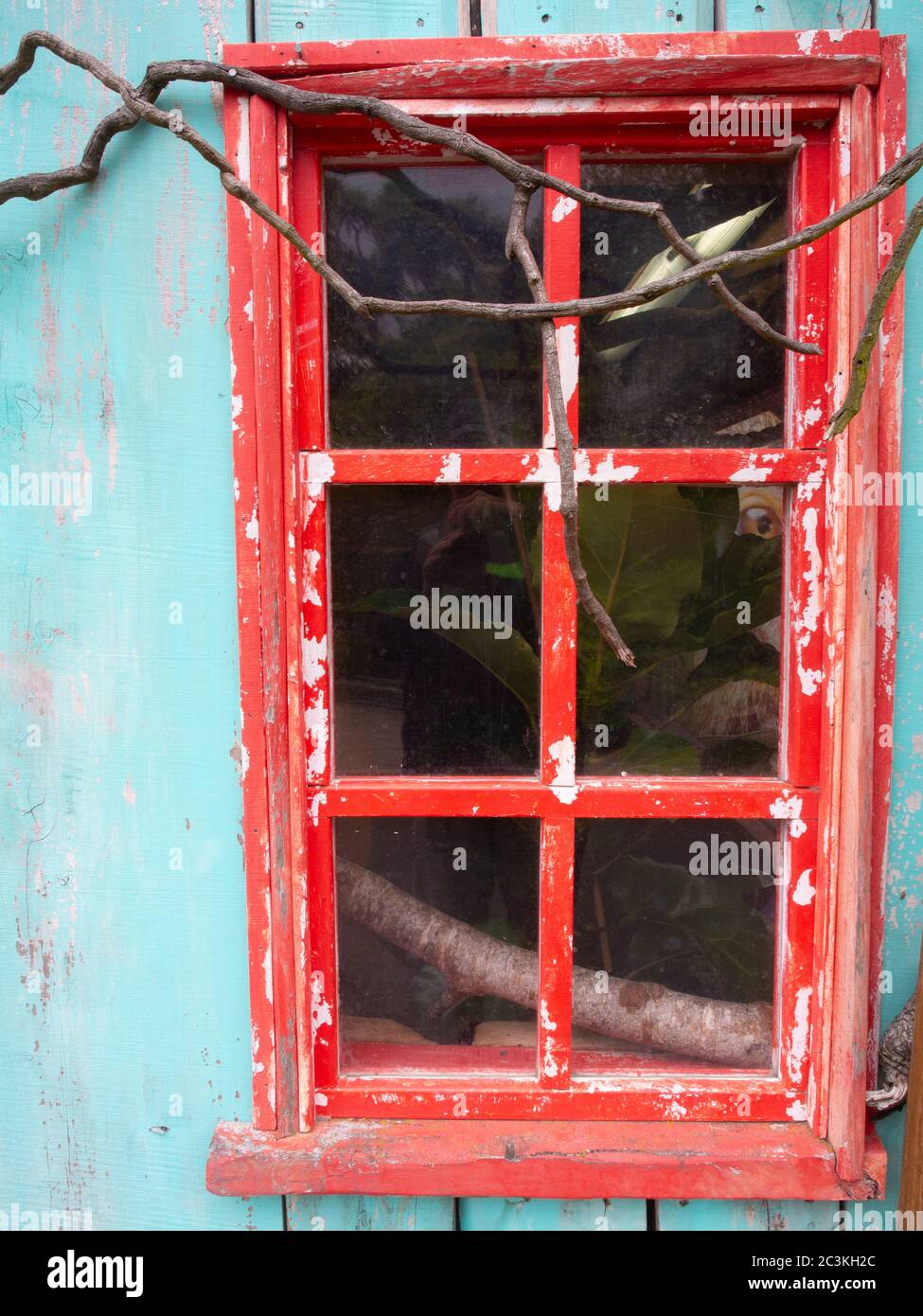 Red Window Frame In A Blue Wall Stock Photo - Alamy