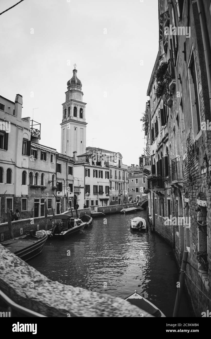 Vertical grayscale picture of Italian unique architecture next to the ...