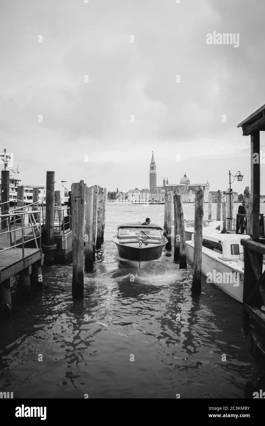 Vertical grayscale picture of a boat in a port Stock Photo - Alamy