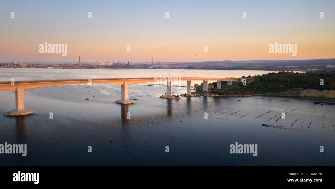 The bridge "Punta Penna" of Taranto at sunrise Stock Photo - Alamy