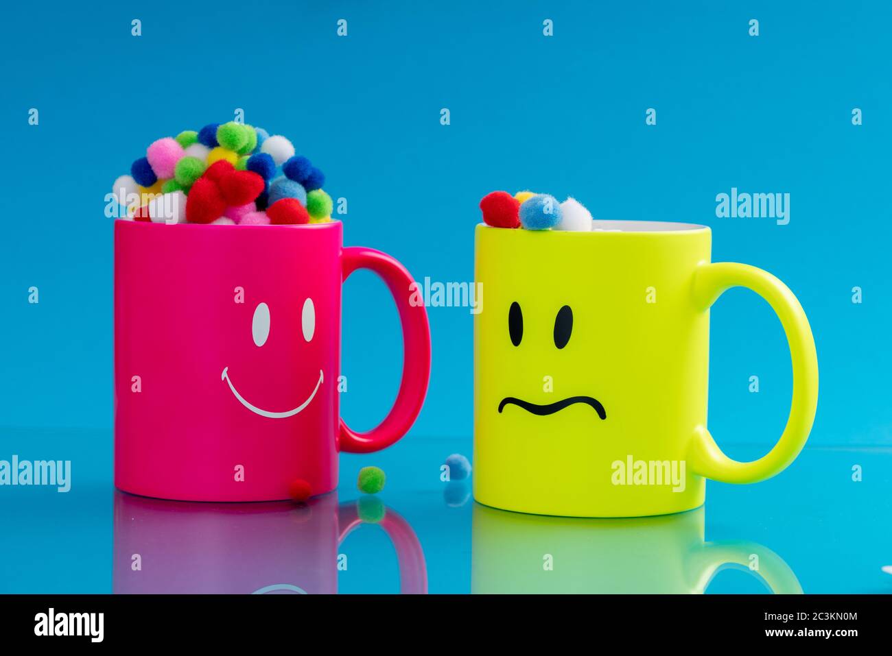 Two mugs with happy and sad emotions on the background. Concept, Coffee ...
