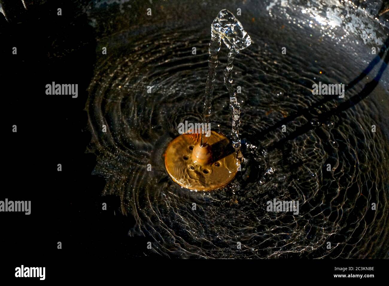 Top view of a small fountain in a city park Stock Photo - Alamy