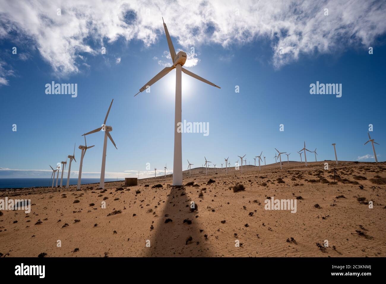 wind turbine in the desert with blue sky background. wind mill farm in ...