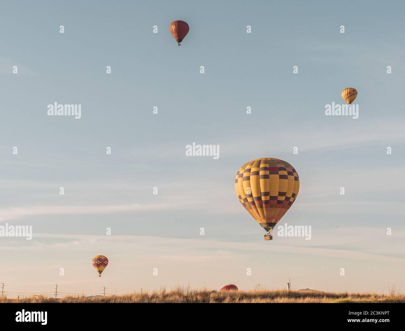 Parachutes flying up in the air during daytime Stock Photo - Alamy