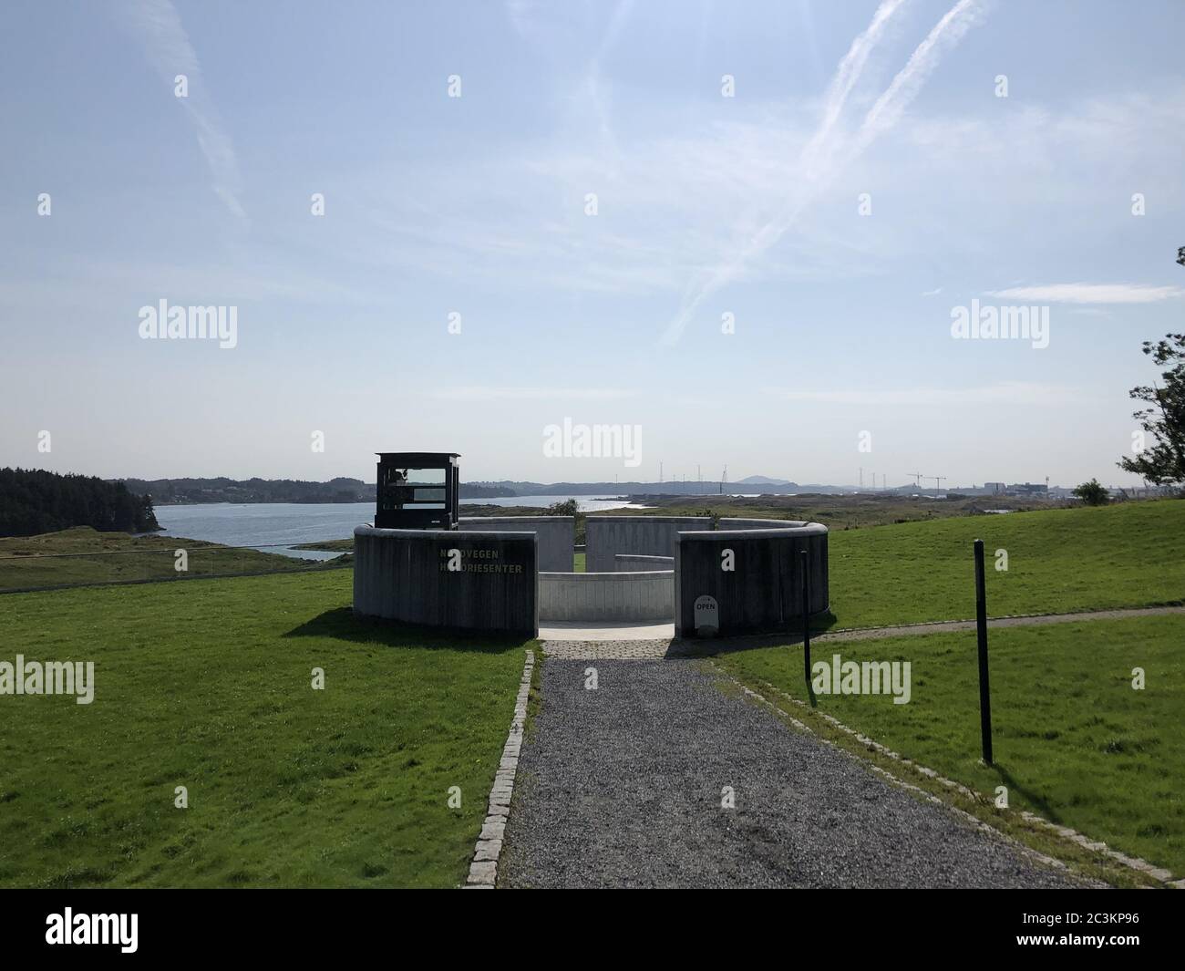 Circular building in the ground surrounded by green landscape Stock ...