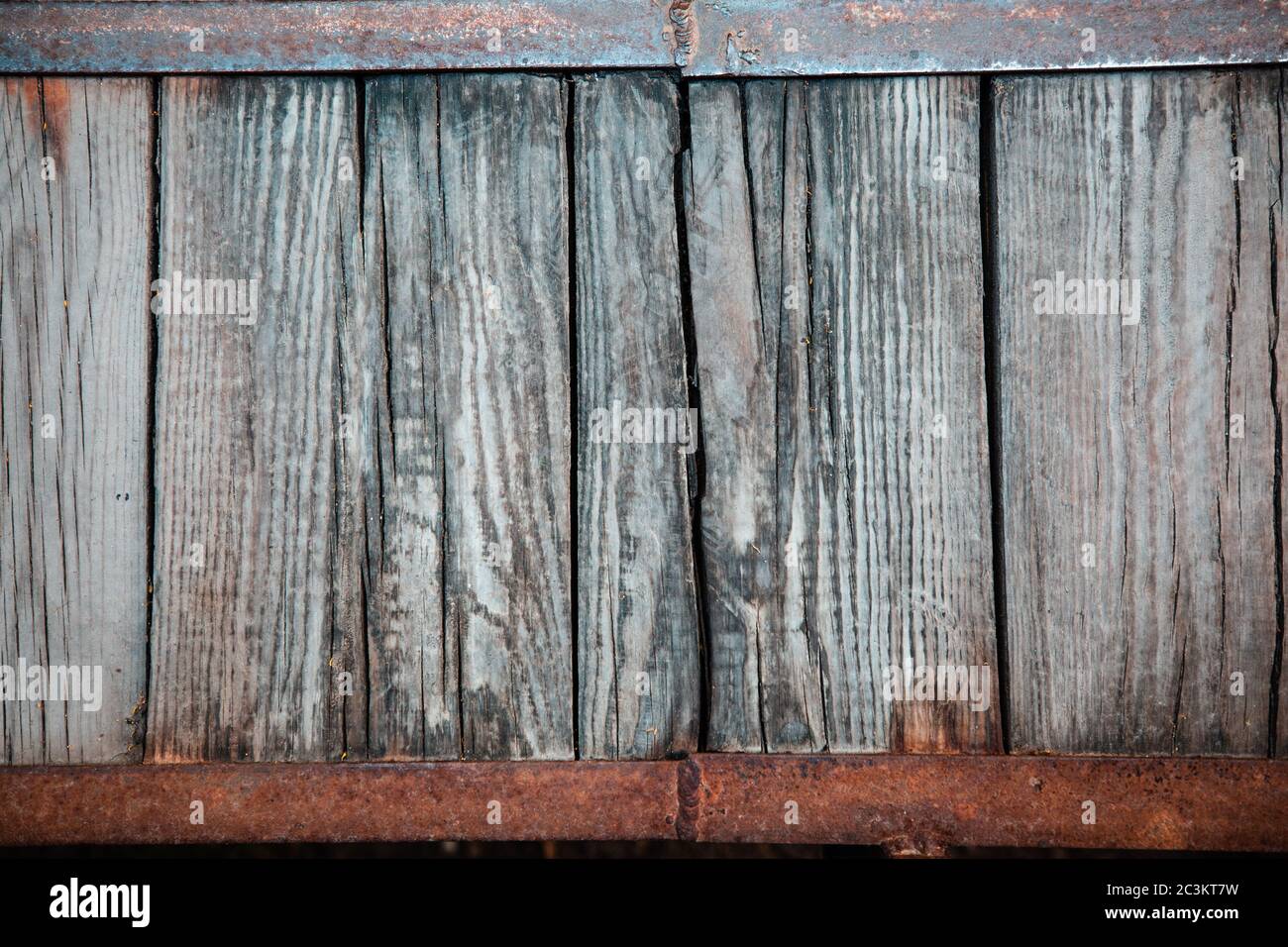 texture of a wooden array on a frame of a metal corner on the stairs ...